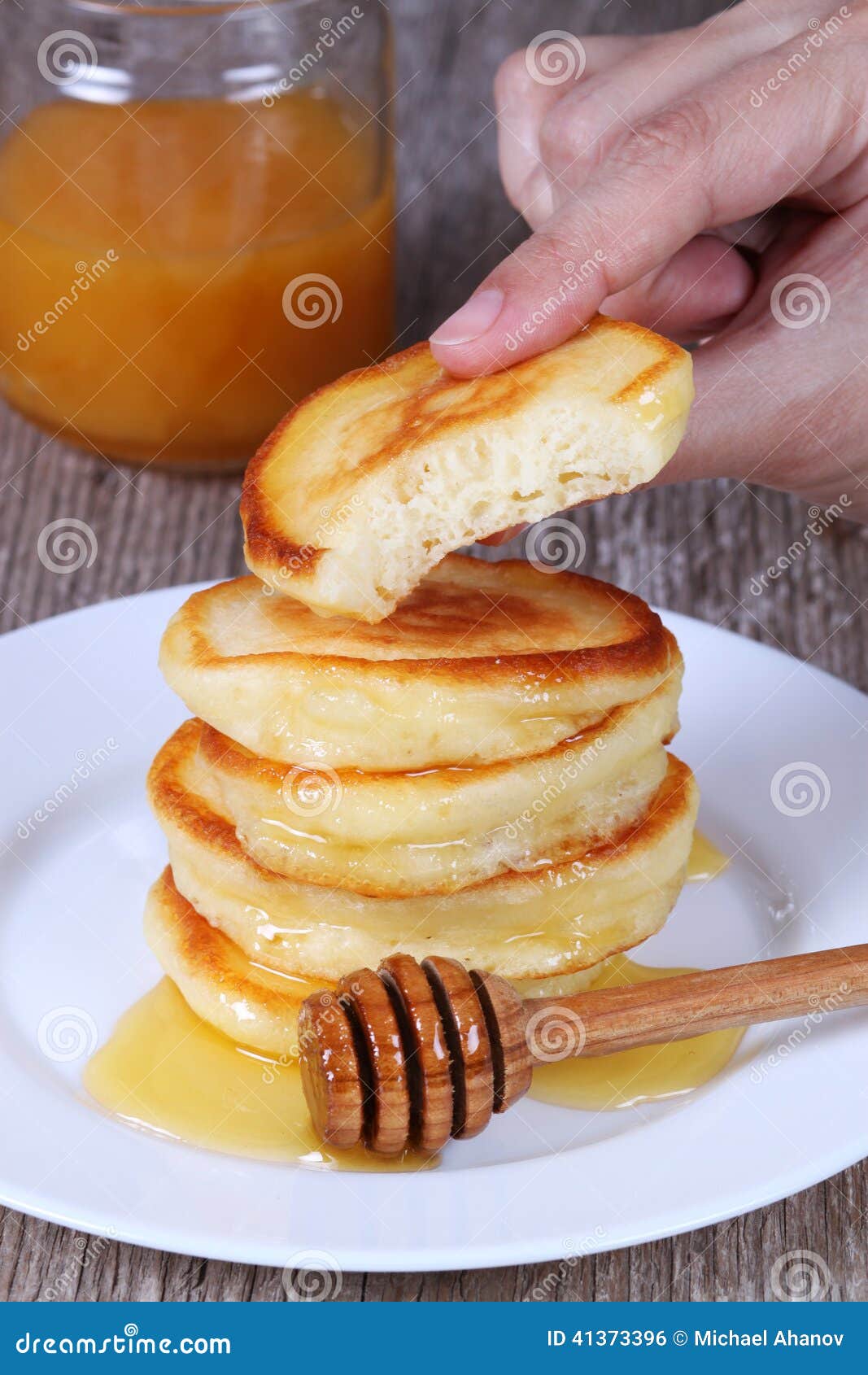 Pancakes with Honey in Hand Stock Photo - Image of lots, pancake: 41373396