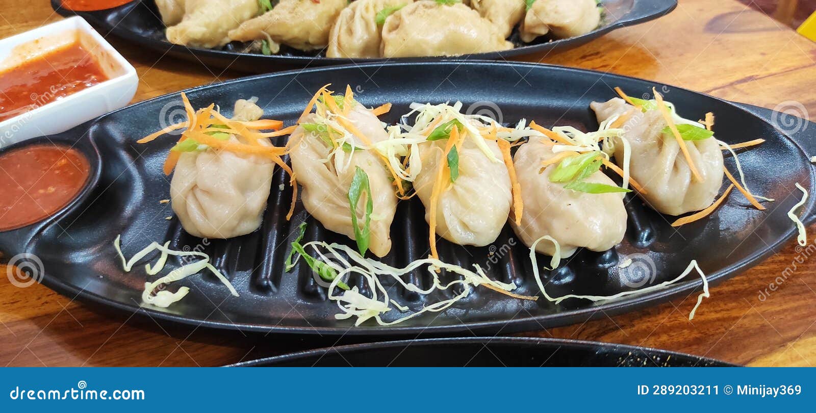 Paneer Momos Decorations with Vegetables - Cabbage, Carrot and Spring ...