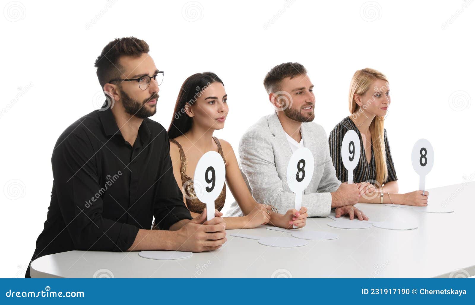 Panel of Judges Holding Different Score Signs at Table on White ...