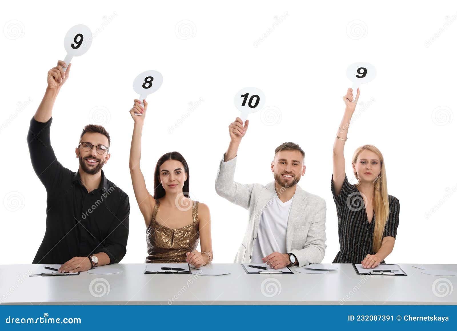 Panel of Judges Holding Different Score Signs at Table on White ...