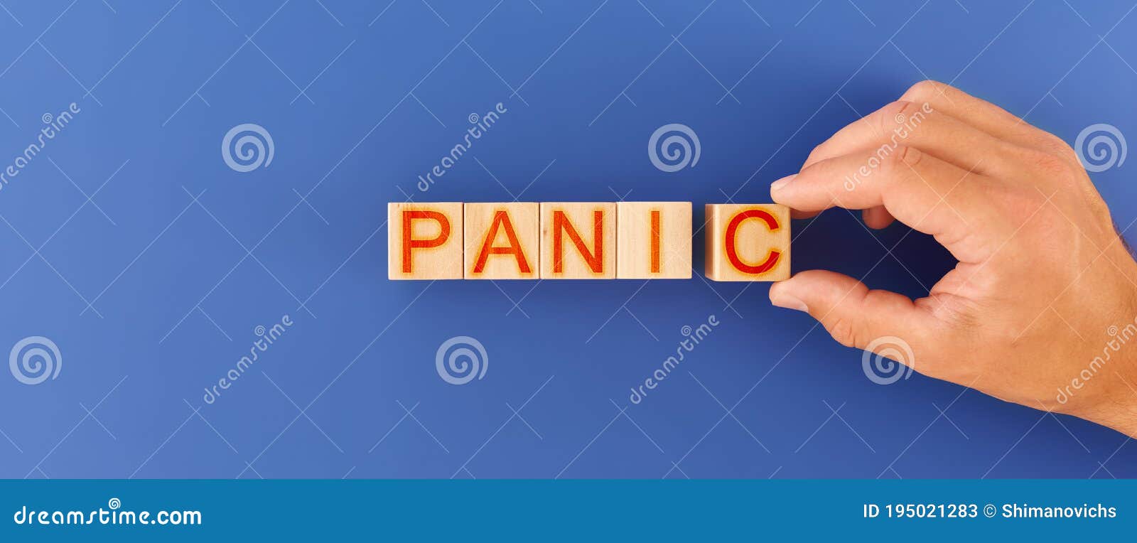 Panic. Man Folds Wooden Blocks into Panic Lettering. Stock Image ...
