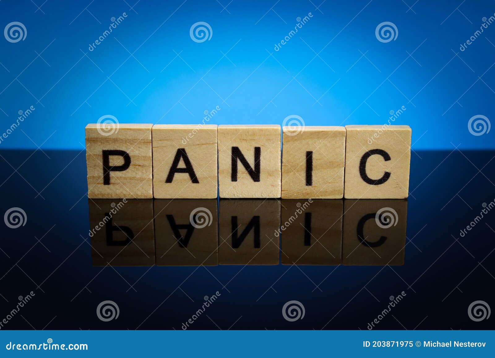 Panic Word on Wooden Blocks on the Mirror Table Stock Image - Image of ...