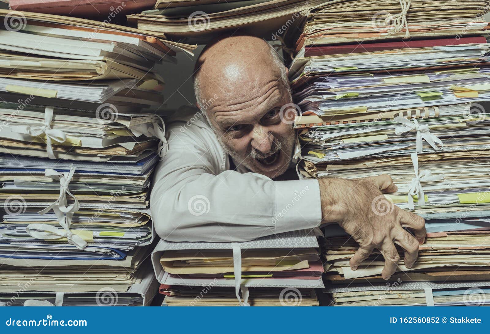 Panicked Businessman Overloaded with Paperwork Stock Photo - Image of ...