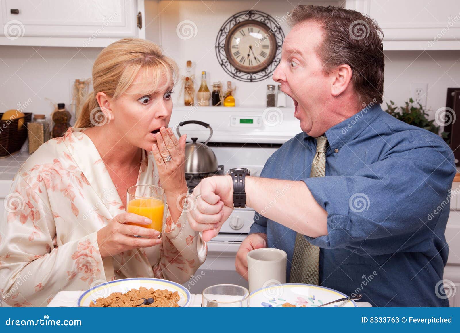 Panicked Couple in Kitchen Late for Work Stock Image - Image of married ...