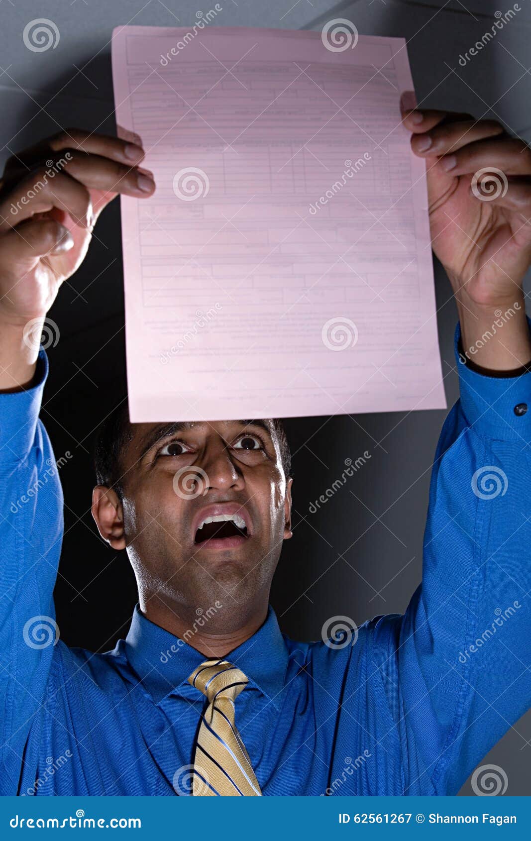 Panicked Man Looking at Form Stock Image - Image of people, arms: 62561267