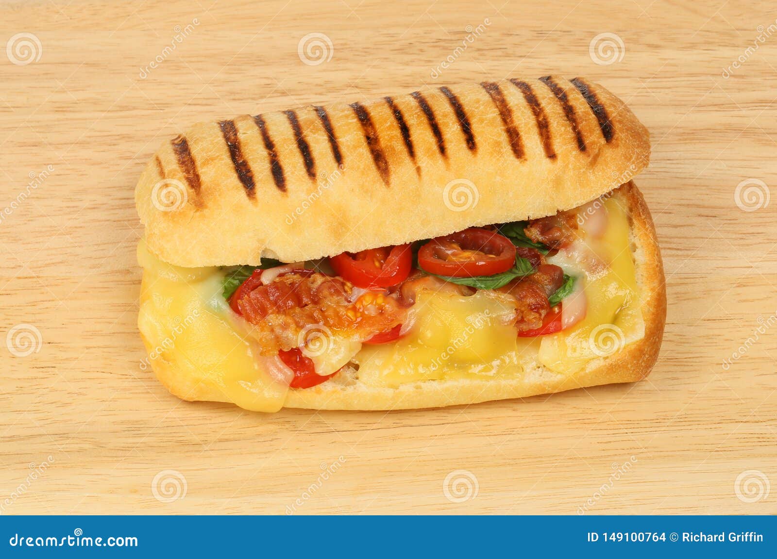 Panini on a board stock photo. Image of tomato, pancetta - 149100764