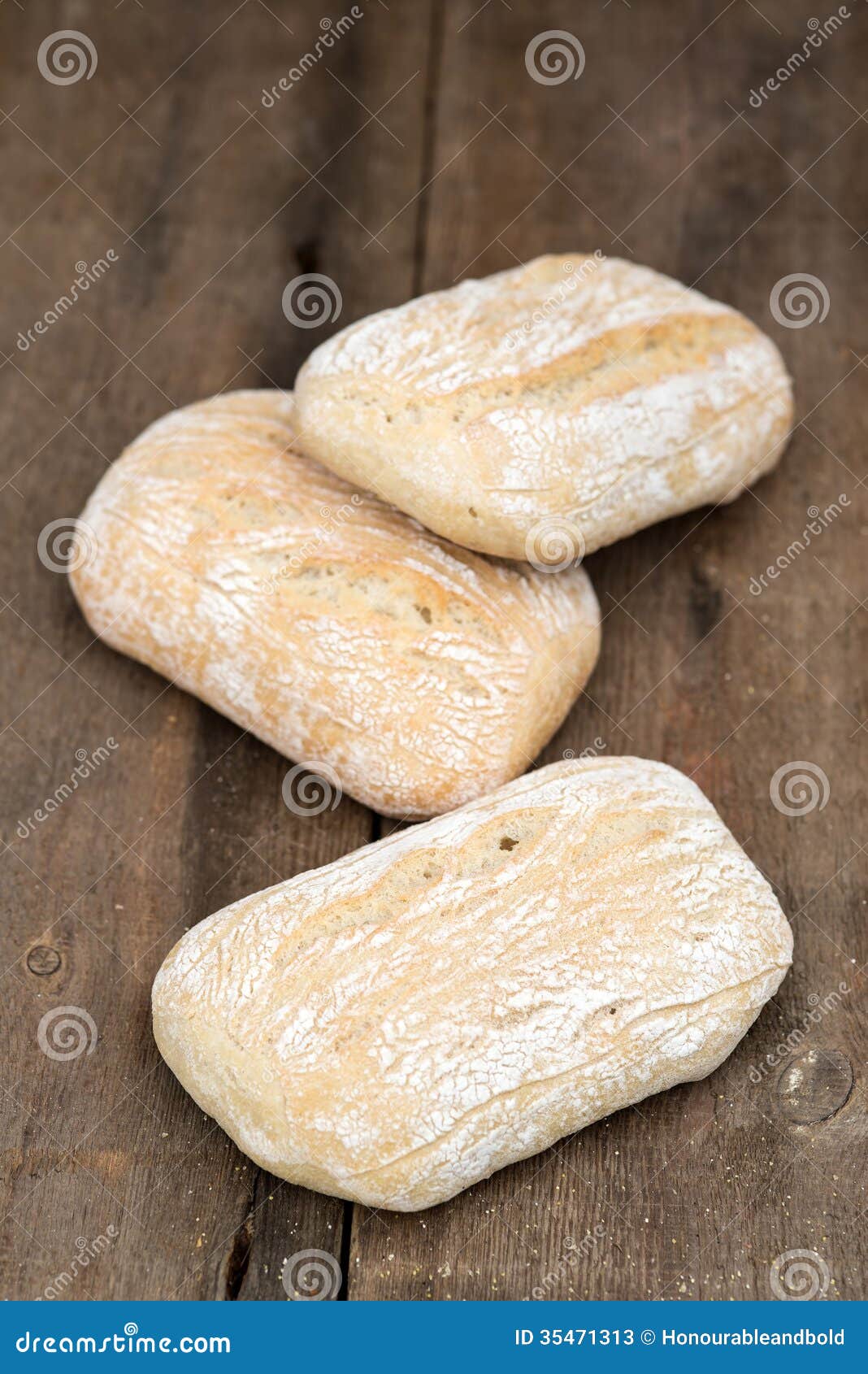 Panini Rolls in Rustic Kitchen Setting with Cooking Utensils Stock ...