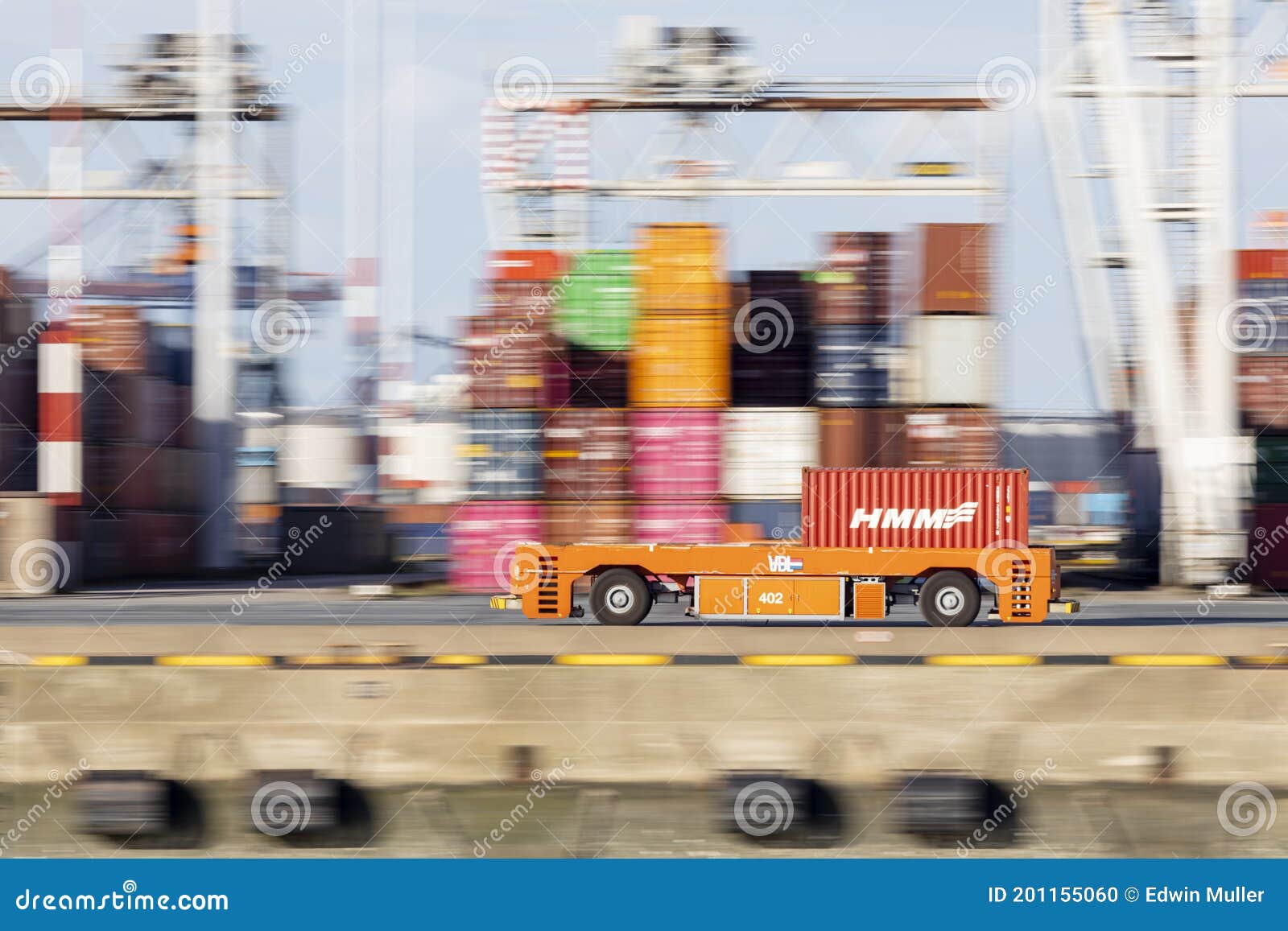 AGV Automated Guided Vehicle On Quay Alongside A Ship In The Port Of ... AGV Automated Guided Vehicle On Quay Alongside A Ship In The Port Of ...