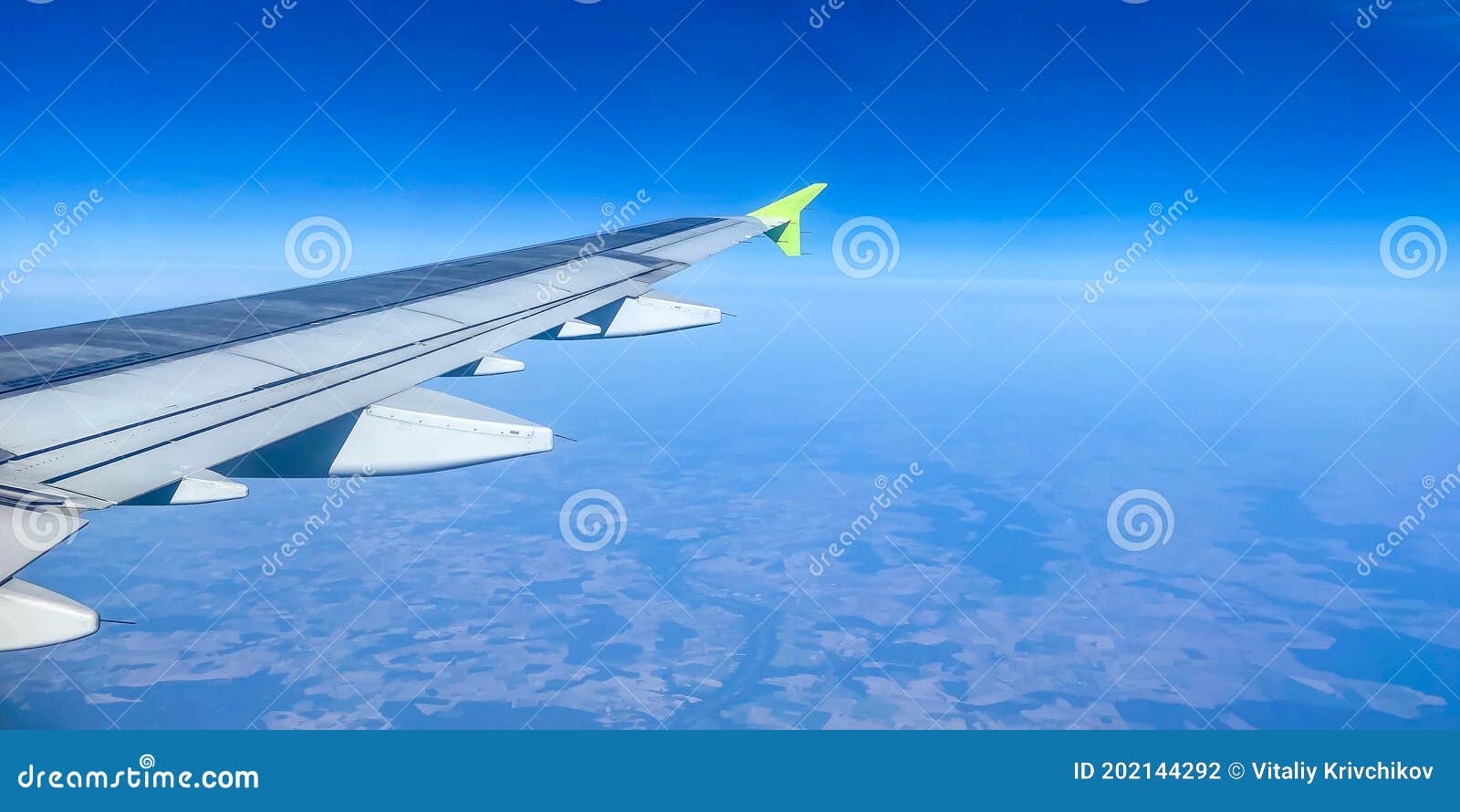 Panorama of Airplane Wing, Bright Blue Sky, Flight on a Passenger Plane ...