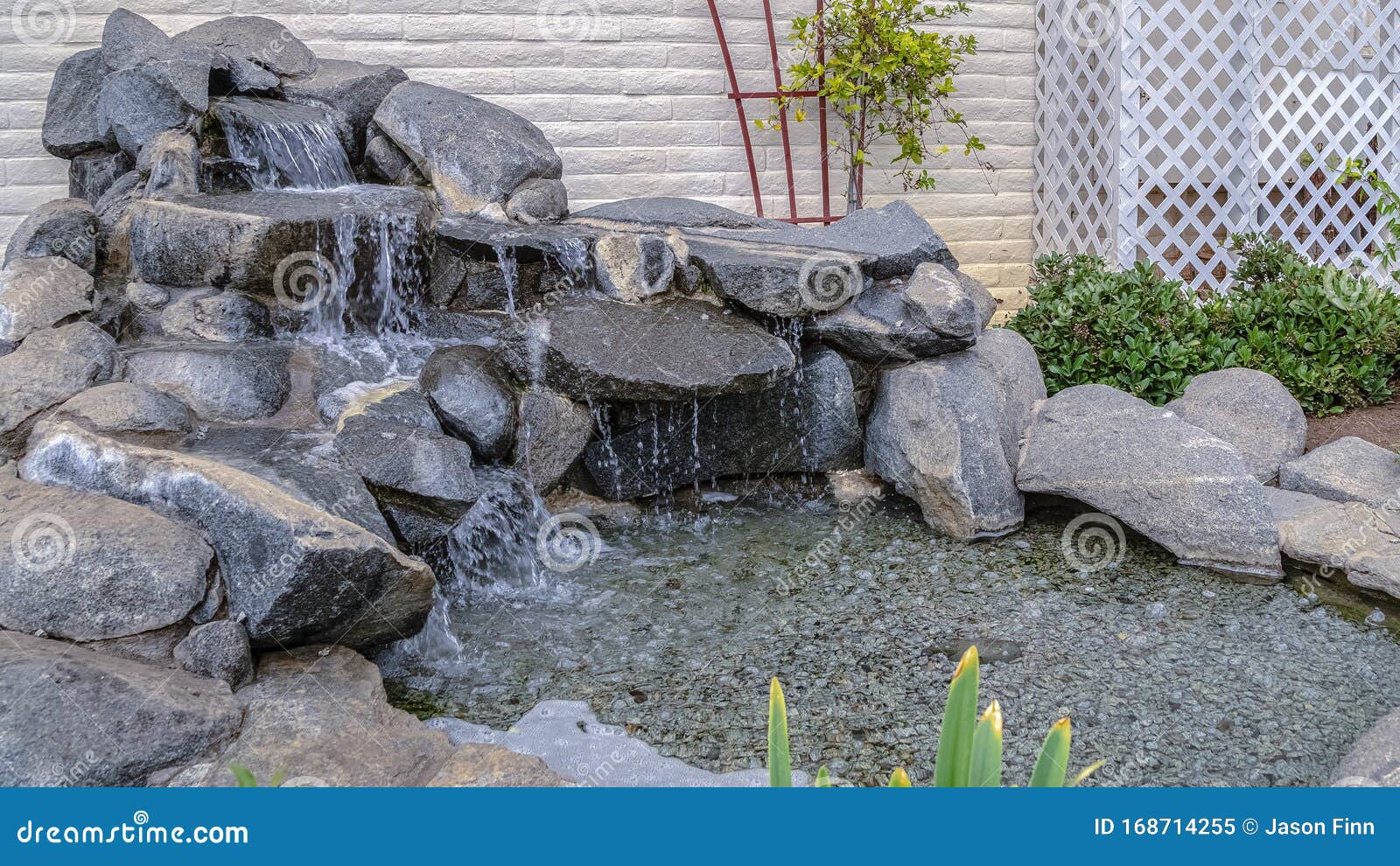 Panorama Artificial Stone Cascade Waterfall in Backyard on a Sunny Day ...