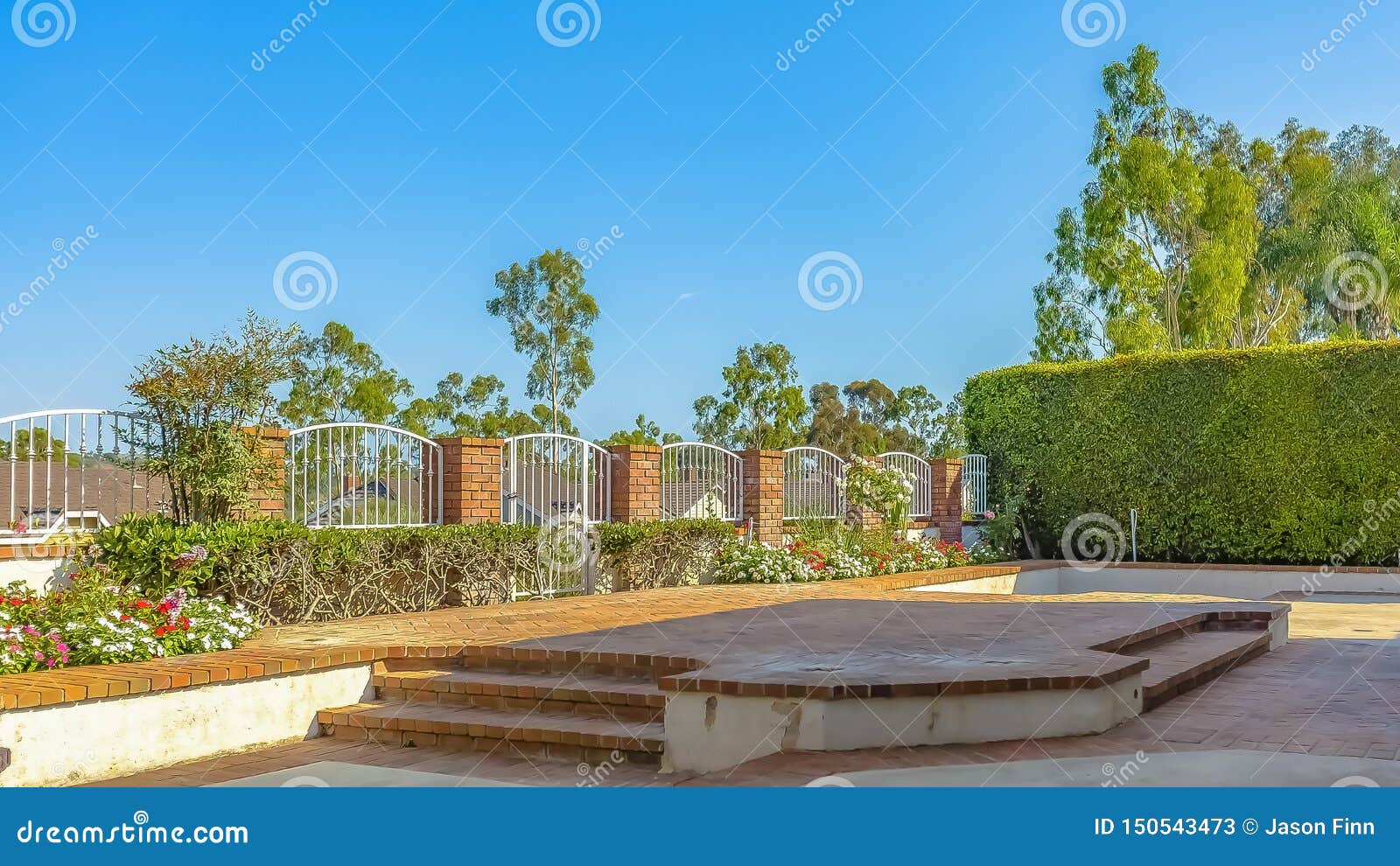 Panorama Brick Patio with a Raised Platform in Front of the Arched ...