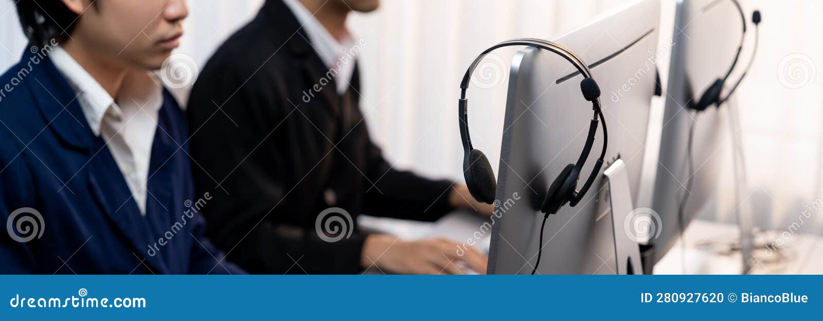 Panorama Focus Headset on Call Center Workspace Desk with Blur Operator ...