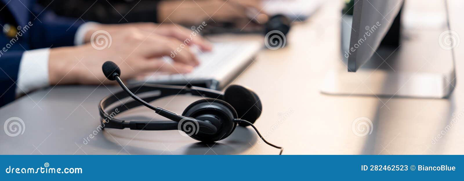 Panorama Focus Headset on Call Center Workspace Desk with Blur Operator ...