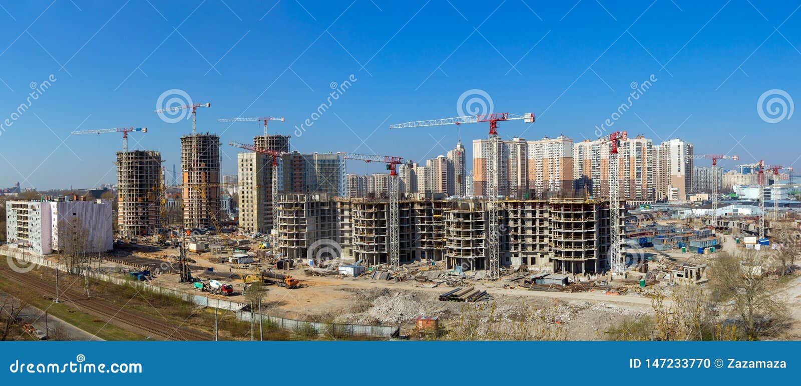 Panorama of Large Construction Site Including Several Cranes Working on ...