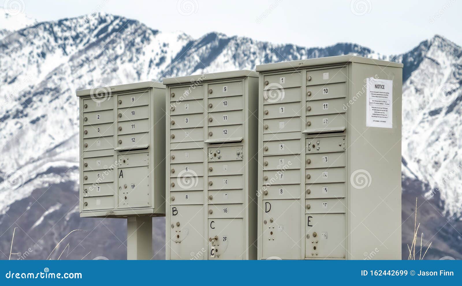 Panorama Mailboxes with Compartments and Numbers Against Snowy Mountain ...