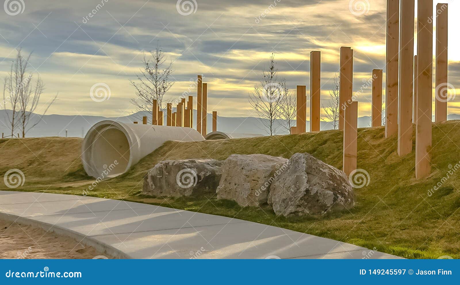 Panorama Paved Pathway Running through a Sandy and Grassy Terrain on a ...