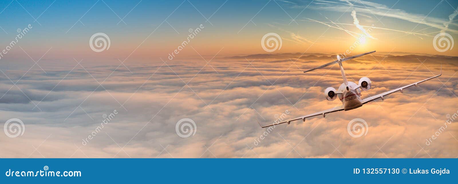 Private Jet Plane Flying Above Dramatic Clouds. Stock Photo - Image of ...