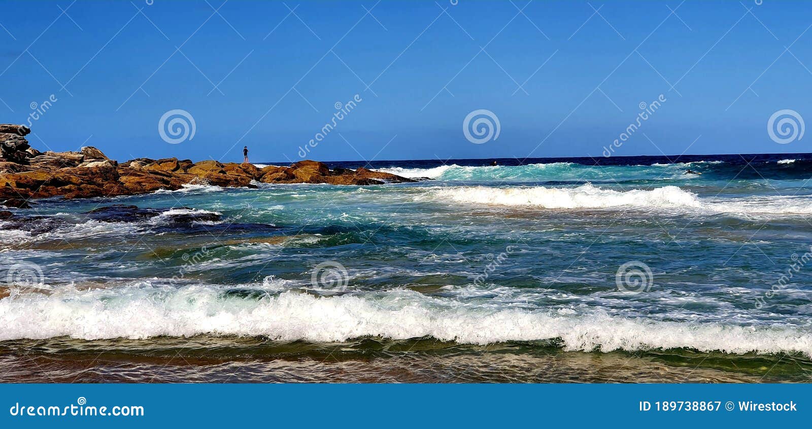 Panoramic Shot of Cliffs Near the Sea Under a Blue Cloudy Sky Stock ...