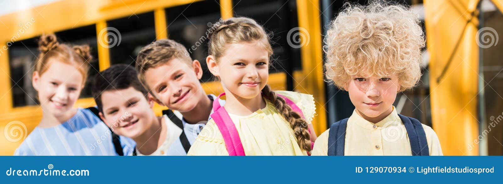 Panoramic Shot of Group of Adorable Pupils Looking at Camera while ...