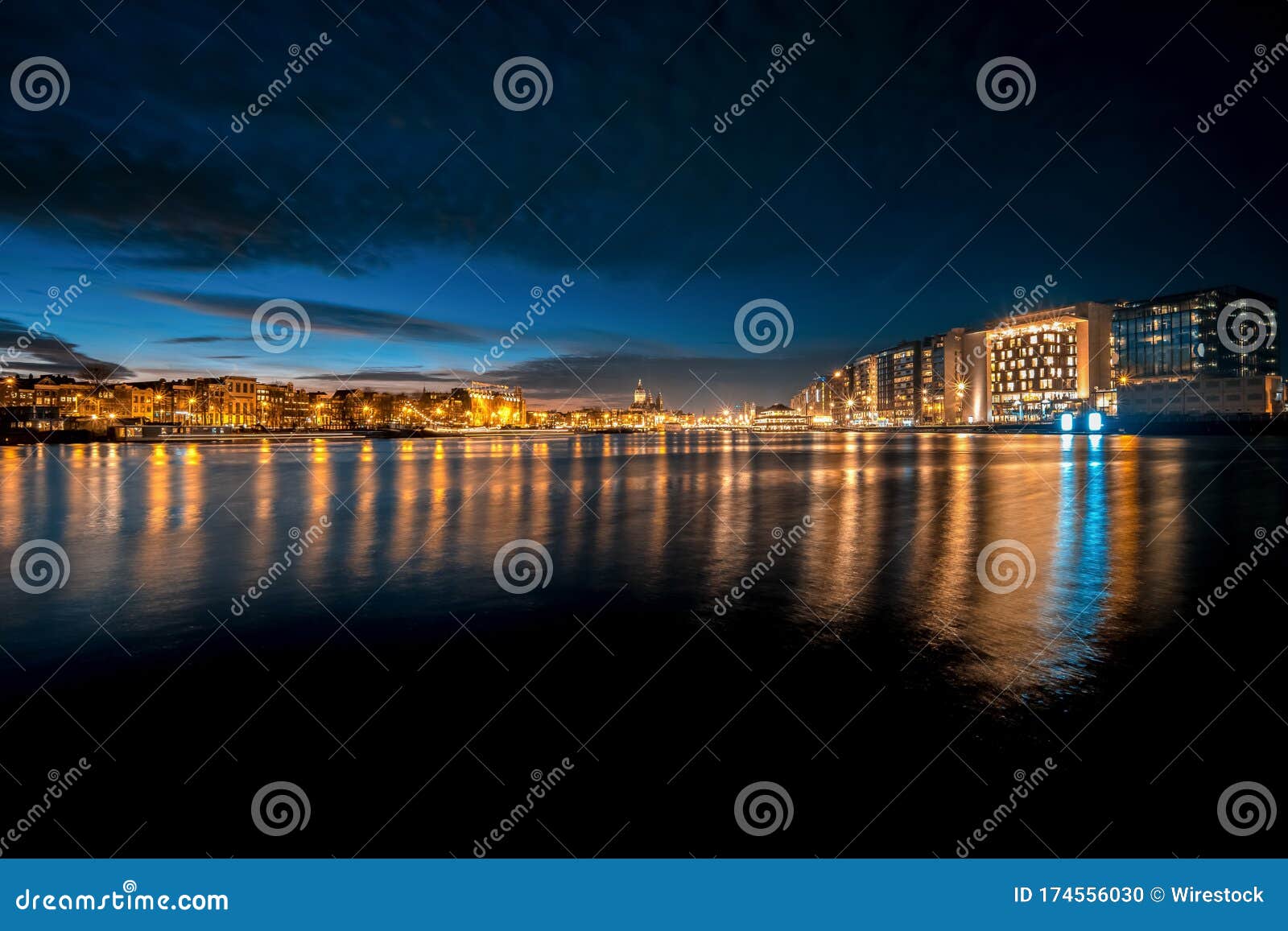 Panoramic Shot of a Night Skyline with Light Reflections on the Water ...