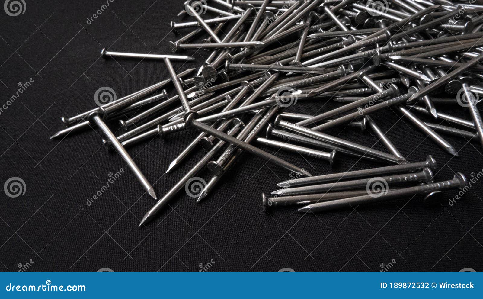Panoramic Shot of a Pile of Steel Nails on a Black Background Stock ...