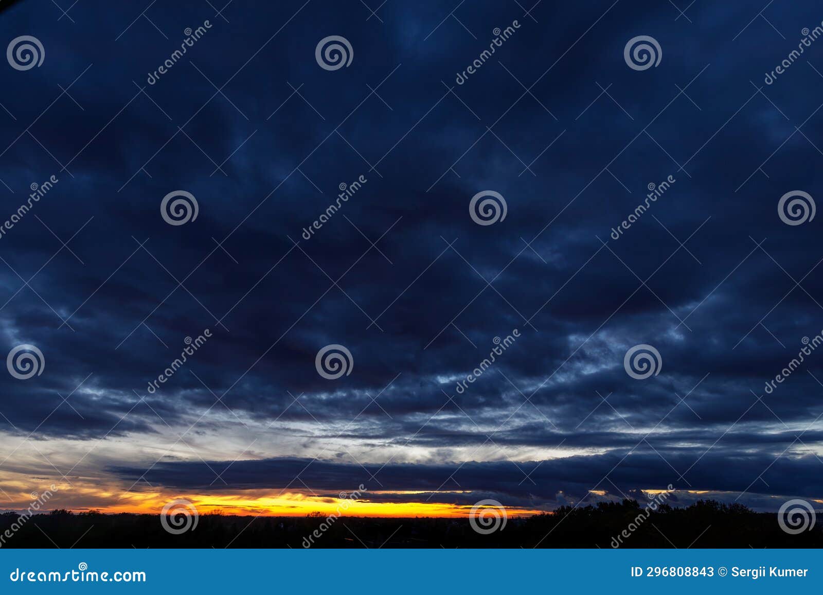 Panoramic Sunset Sky with Heavy Dark Blue Clouds and Orange Line of Sun ...