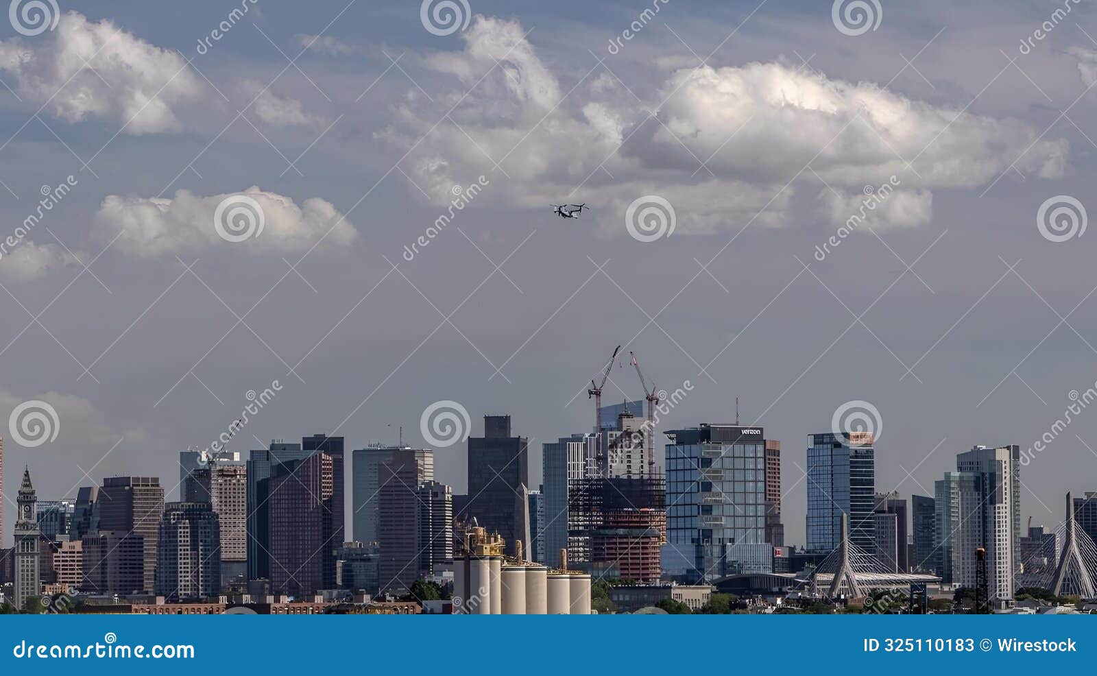 Panoramic View of the Boston Skyline with a Helicopter Flying Above and ...