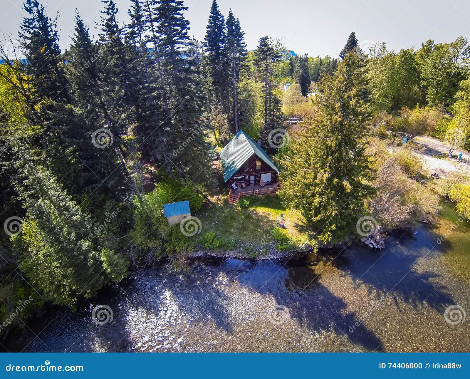 Panoramic View of Cabin Style Home on a River Bank Stock Photo - Image ...