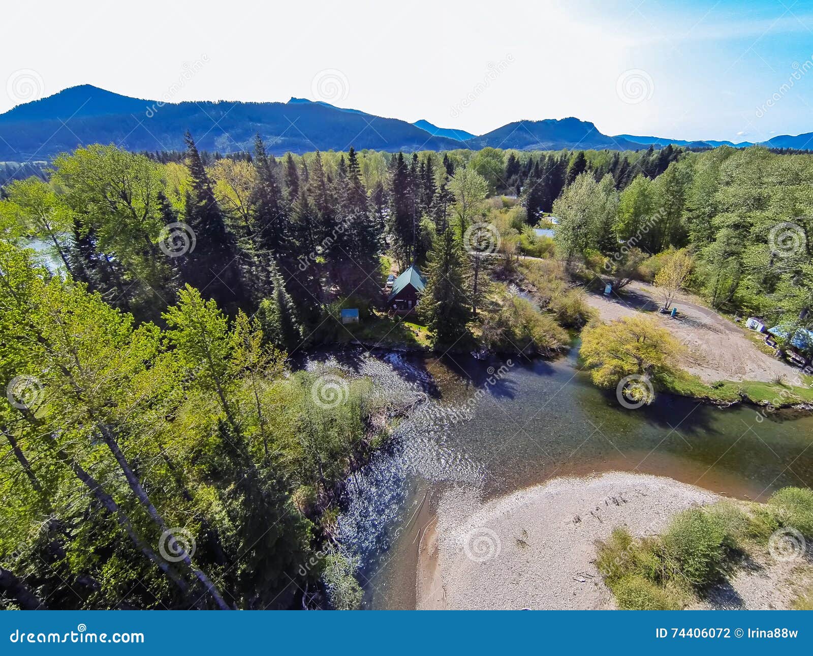 Panoramic View of Cabin Style Home on a River Bank Stock Photo - Image ...