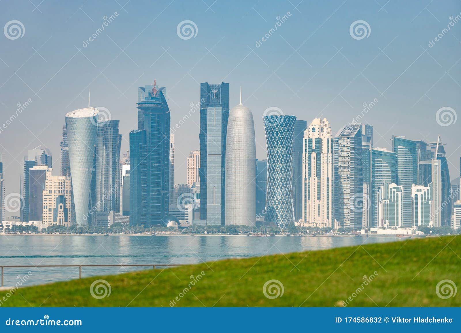 Panoramic View of Modern Skyline of Doha with Green Grass Foreground ...