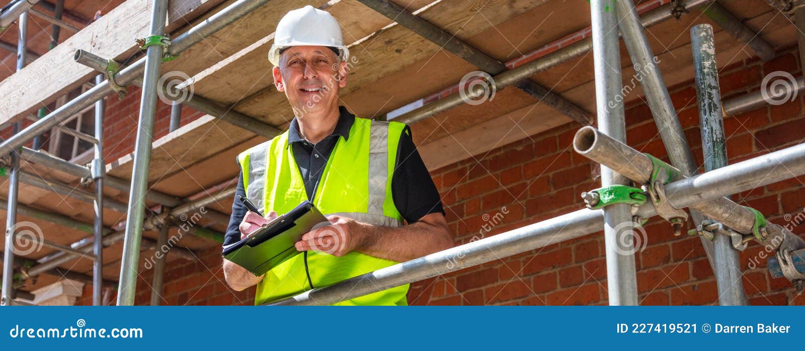 Builder Construction Worker Contractor on Building Site with Clipboard ...