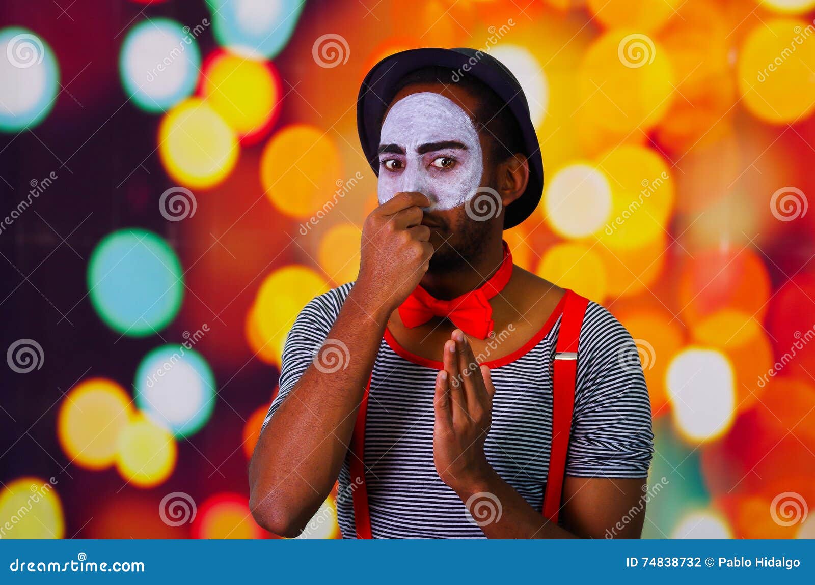 Pantomime Man Wearing Facial Paint Posing For Camera, Using Hands ...