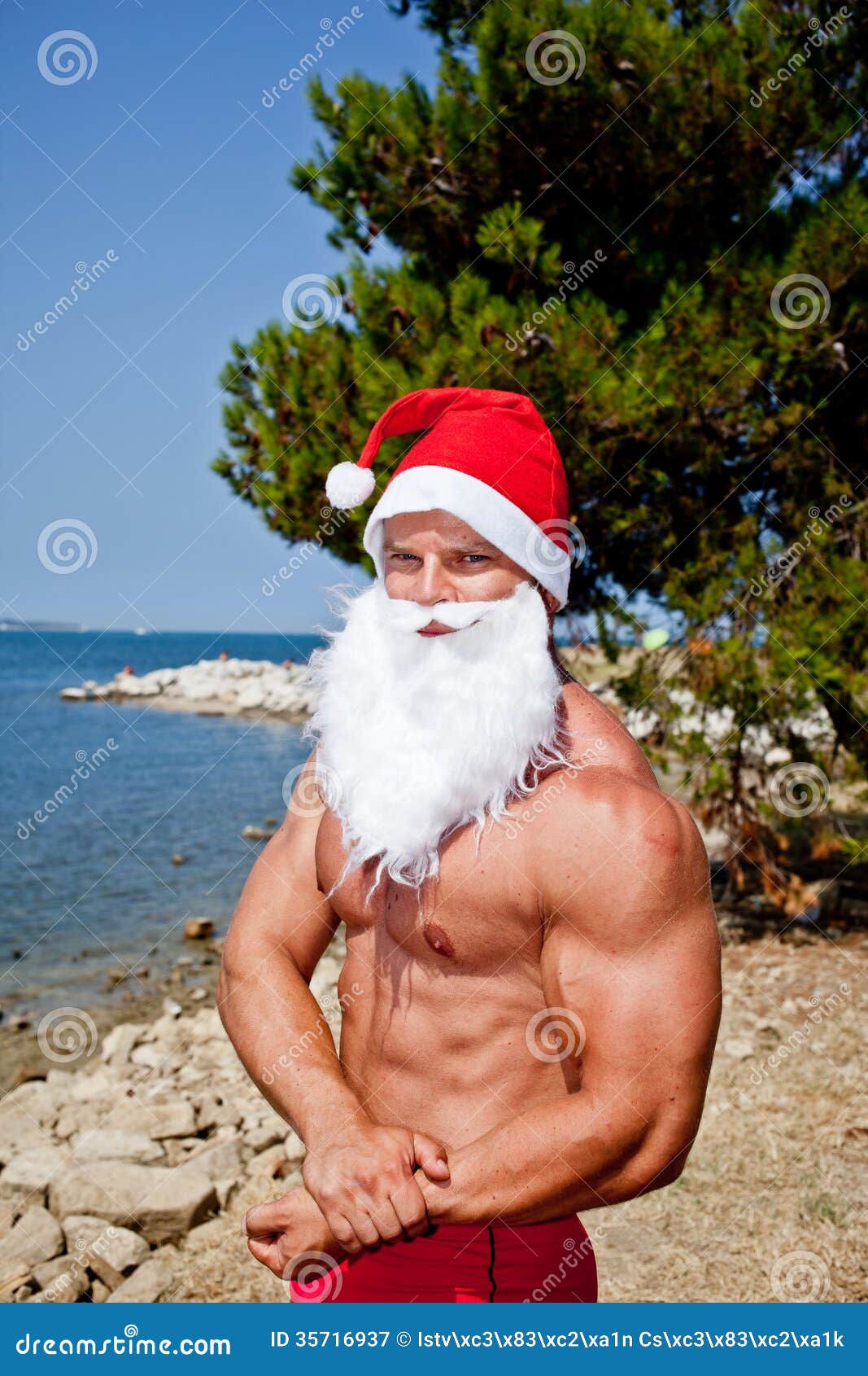 Papá Noel muscular imagen de archivo. Imagen de fondo - 35716937