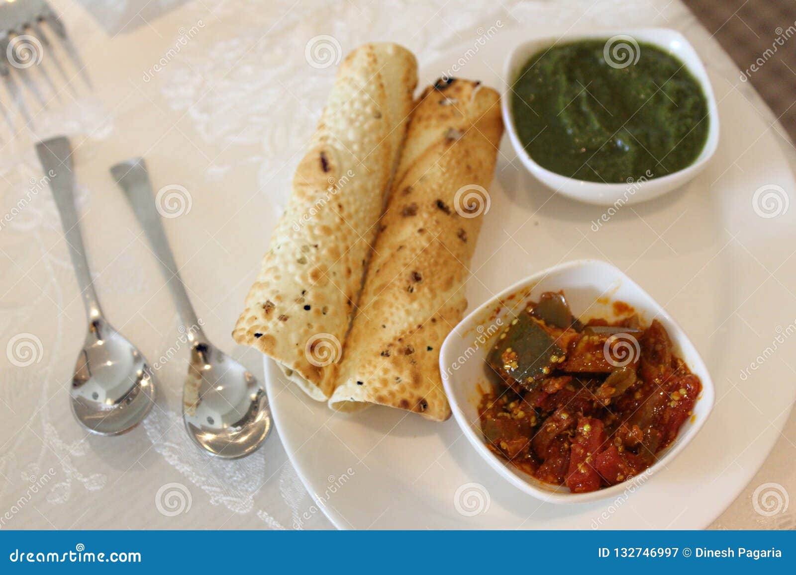 Papad, Chatni, Pickles, Spoons Etc Arranged in a Plate Stock Image ...