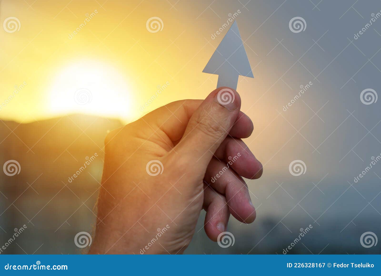Paper arrow in the hand. stock image. Image of idea - 226328167