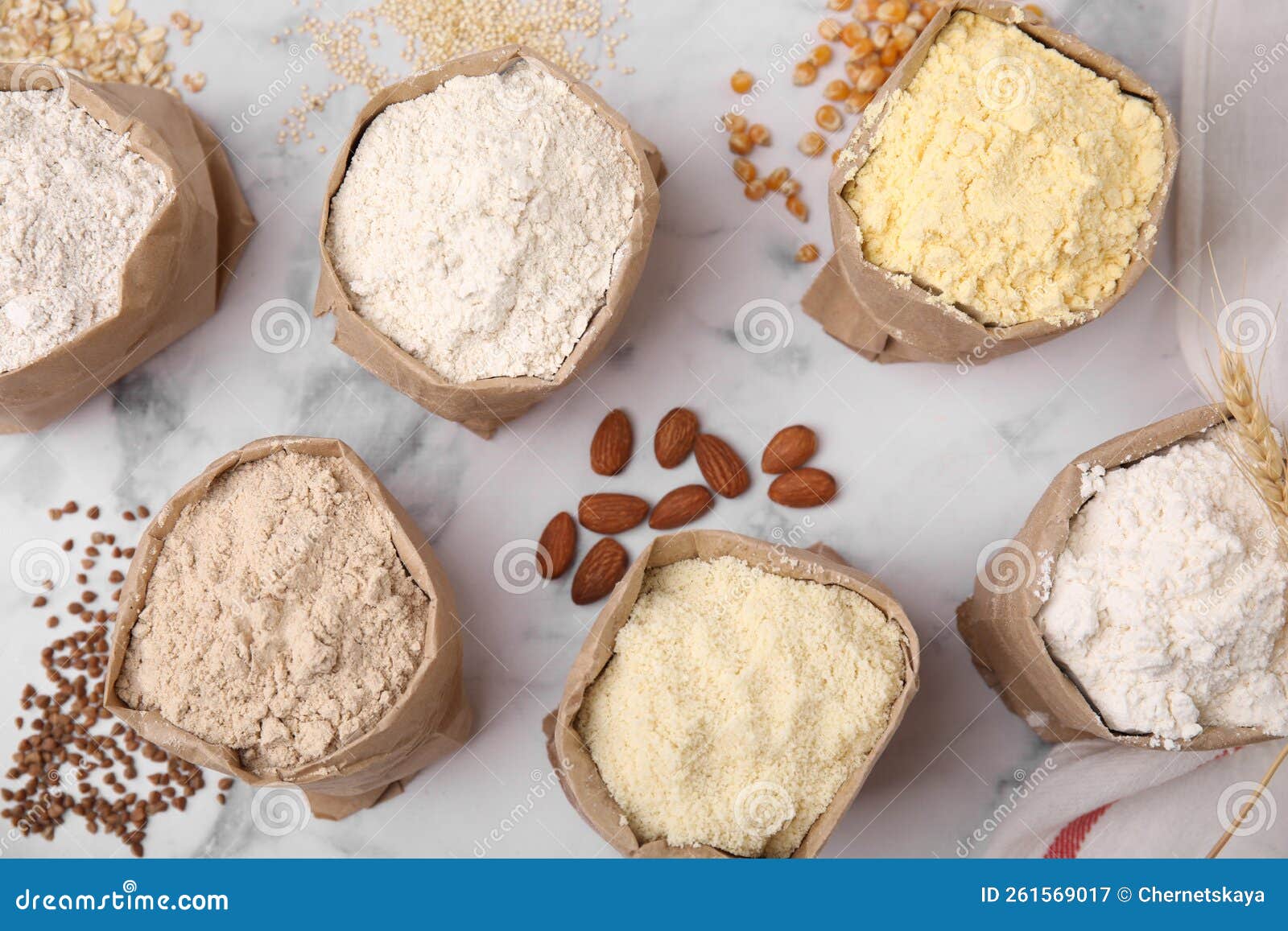 Paper Bags with Different Types of Flour and Ingredients on White ...