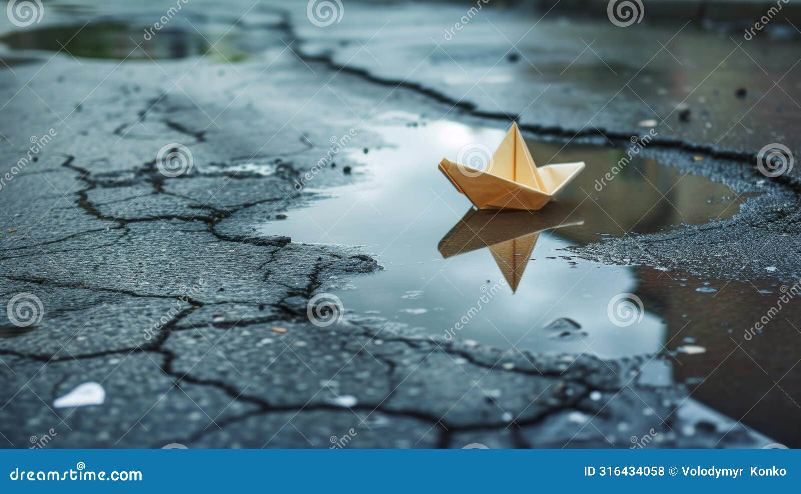 Paper Boat in a Puddle on a Cracked Road Stock Photo - Image of ...