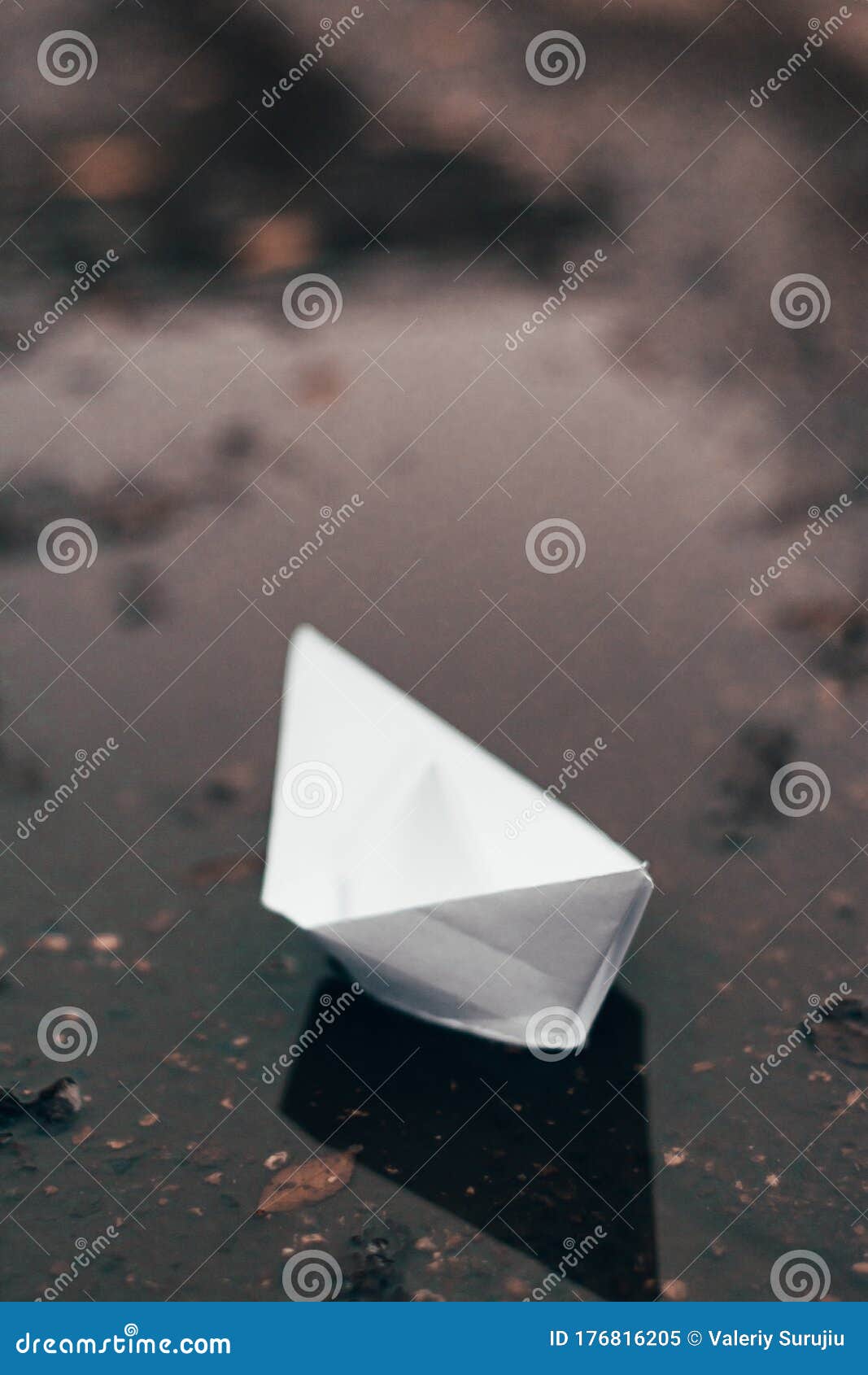 Paper boat on puddle stock image. Image of black, cash - 176816205
