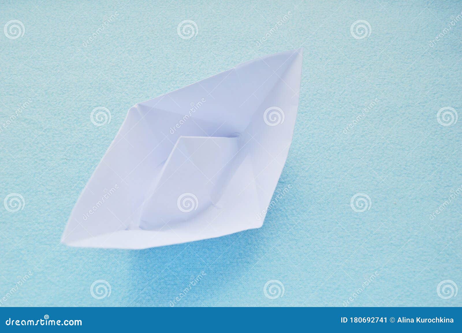 Paper Boat Step by Step Instructions. White Paper on a Blue Background ...