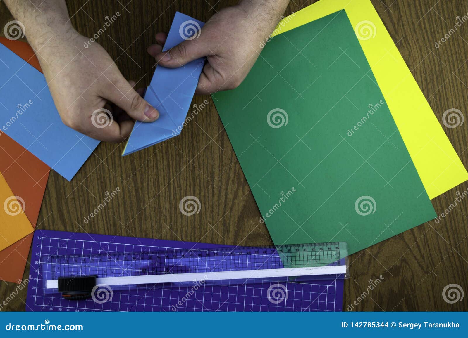 Paper Bunny for Easter, Hands Make Origami from Colored Paper, Origami ...