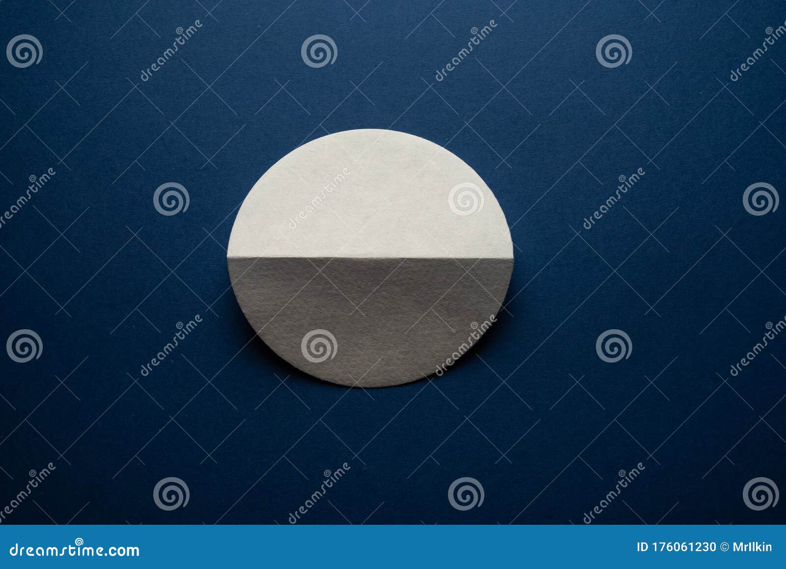 The Paper Circle is Folded in Half on Dark Blue. the Light and Dark ...