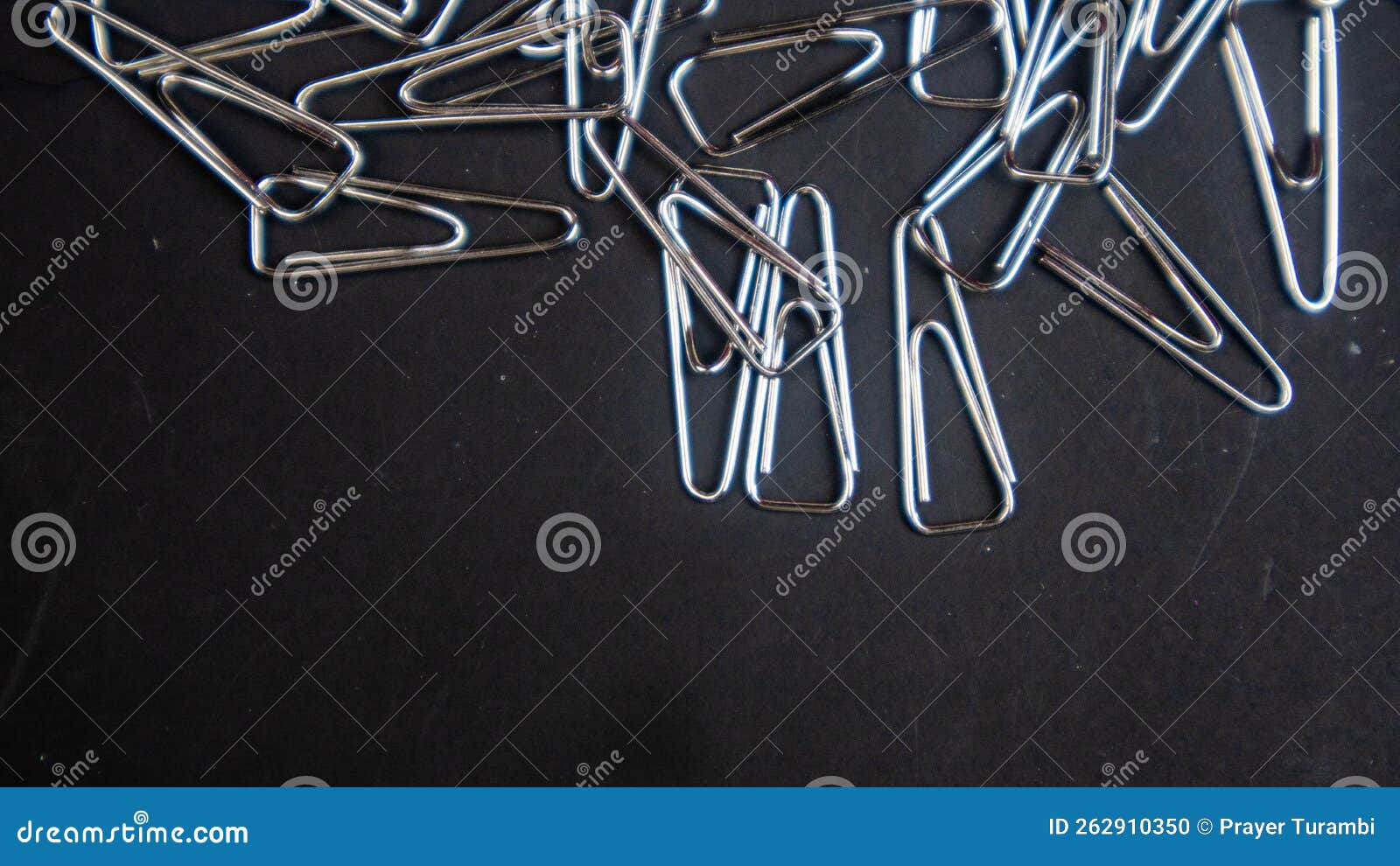 A Paper Clip on a Black Background Stock Photo - Image of plastic ...