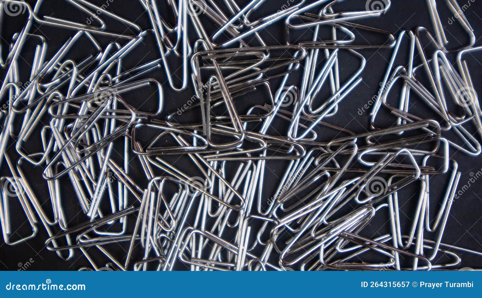 A Paper Clip on a Black Background Stock Image - Image of plastic ...