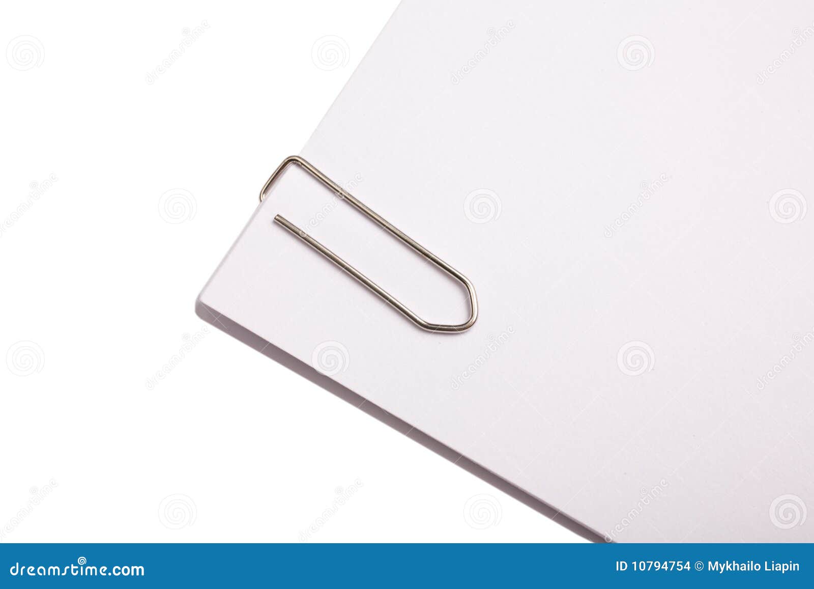 Paper clip on paper stock photo. Image of curve, remote - 10794754