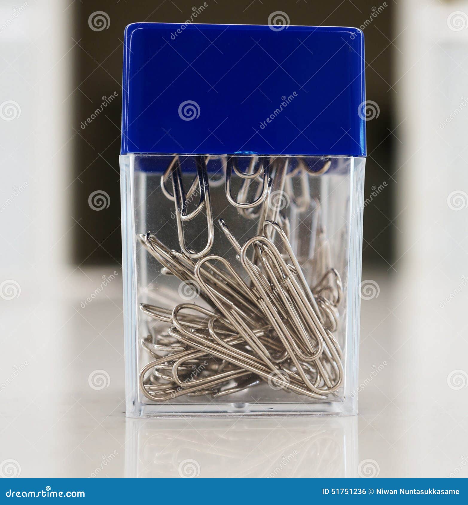 Paper clips on plastic box stock photo. Image of metallic - 51751236