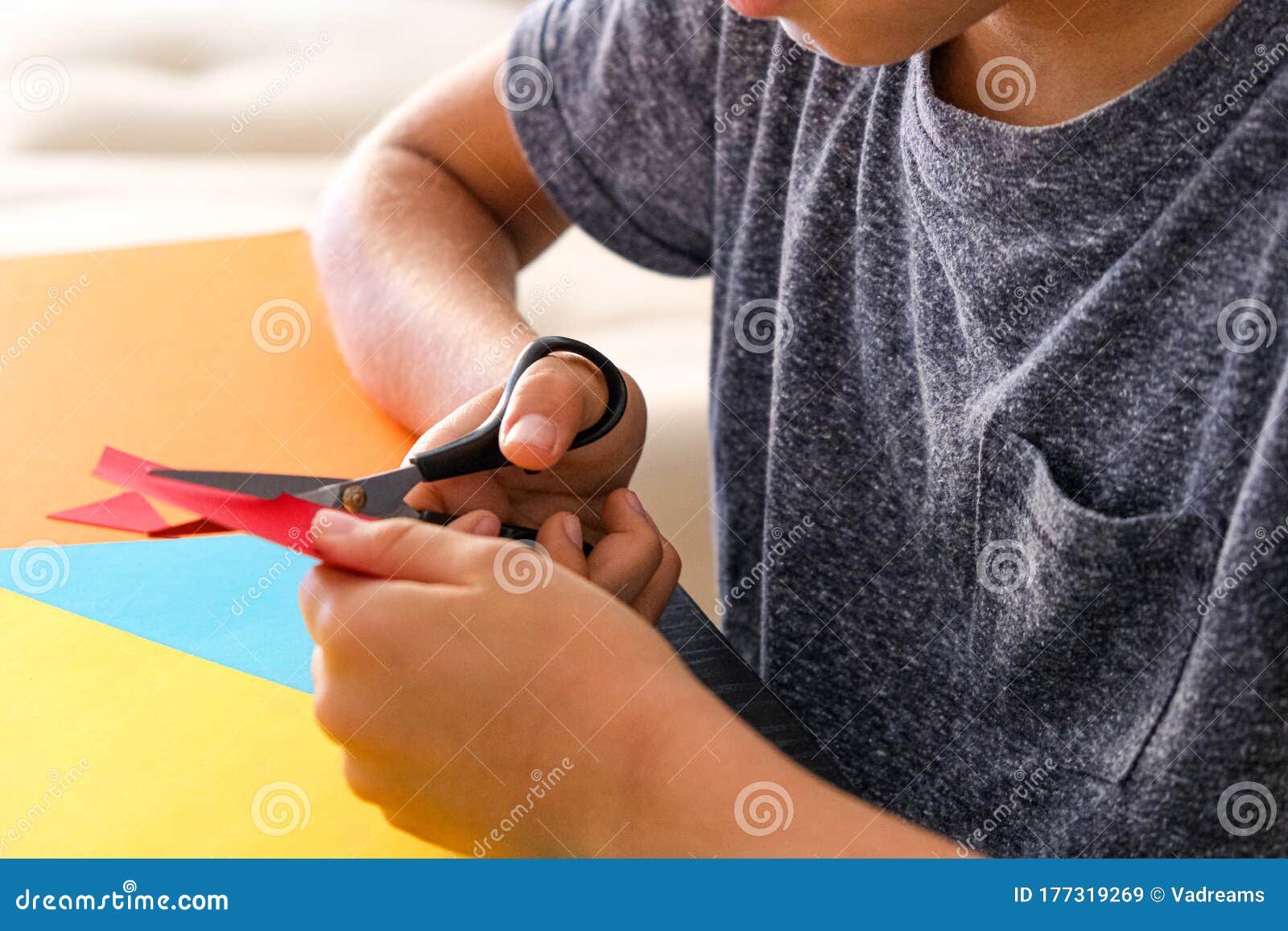 Paper Crafts for Kids. Child Hands Cutting Colored Paper with Scissors ...