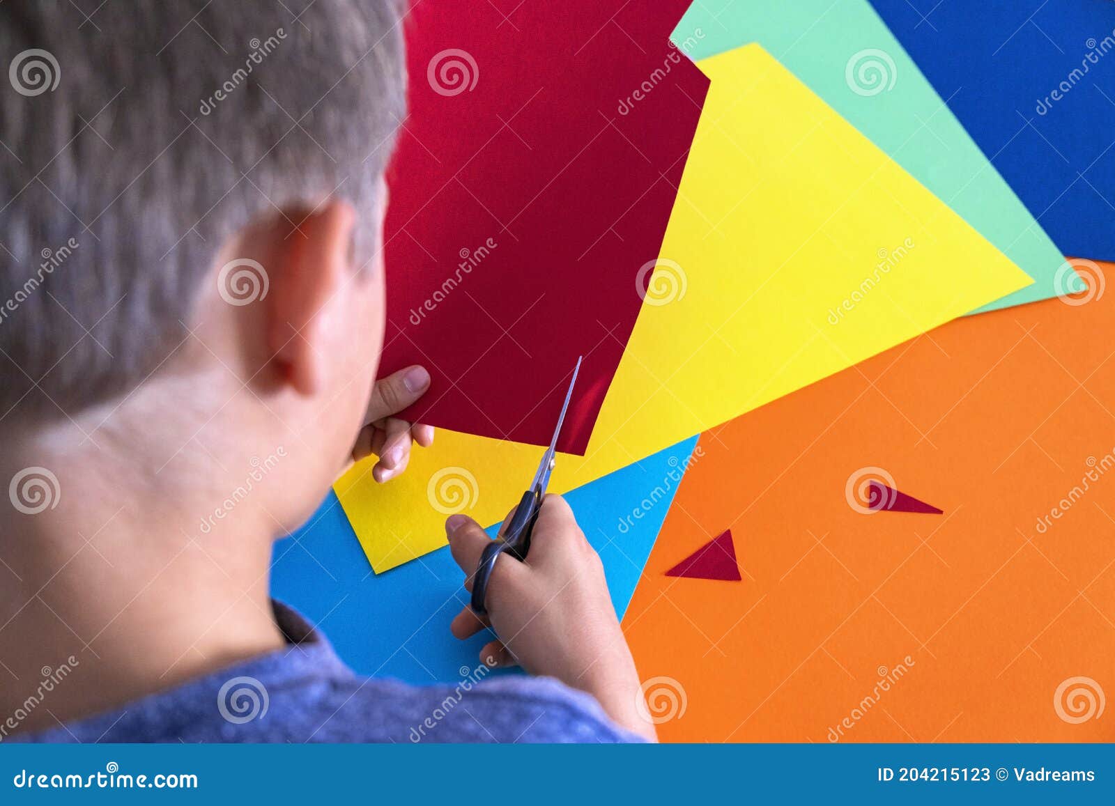 Paper Crafts for Kids. Child Hands Cutting Colored Paper with Scissors ...
