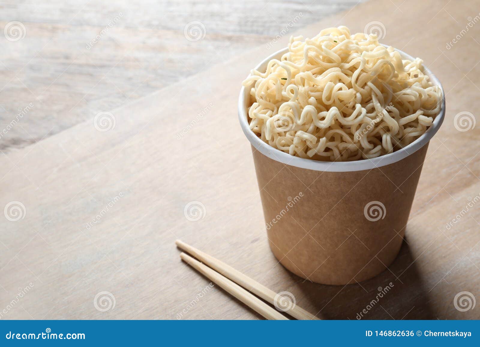 Paper Cup of Instant Noodles and Chopsticks on Table Stock Photo ...