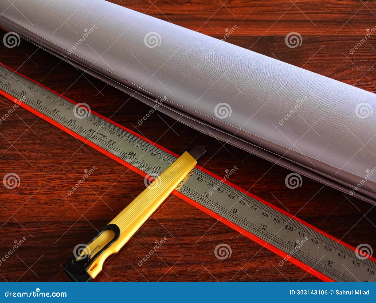 Paper, Cutter and Ruler on the Work Table with Angels 45 Degrees Stock ...