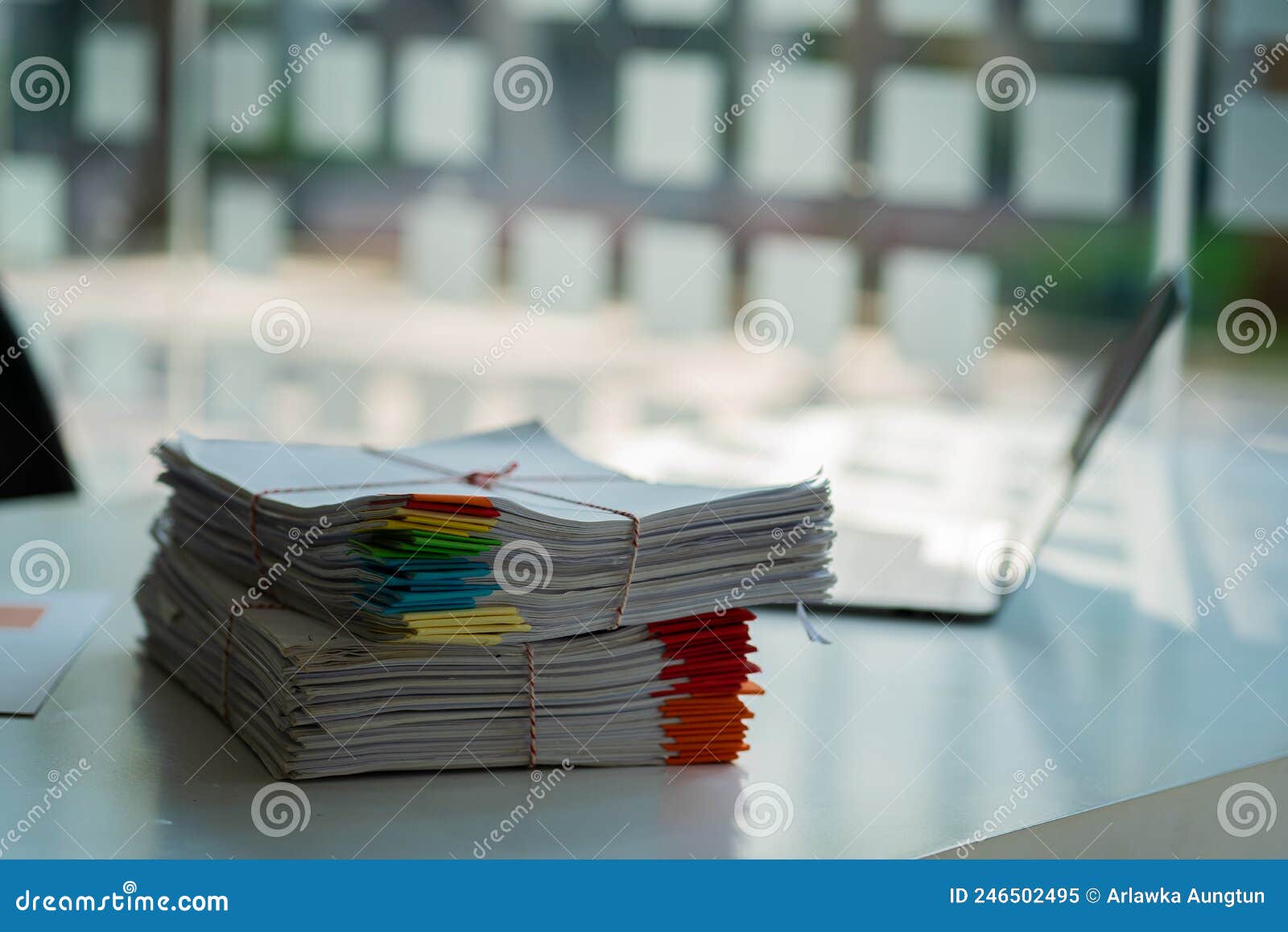 Paper Documents Stacked on a Wooden Table at Work. Business Idea Laptop ...